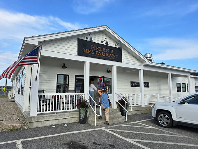 Helen's Restaurant: Where nostalgia meets flavor! This charming white facade promises comfort food that'll transport you straight back to grandma's kitchen.
