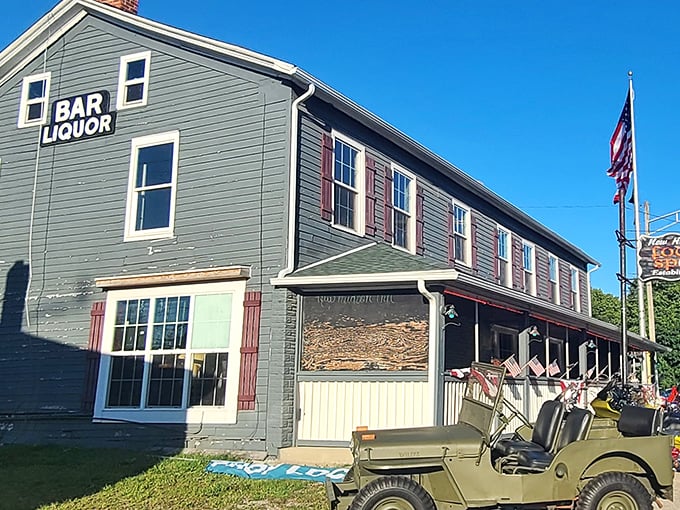 "Bar Liquor" sign by day, time machine by night! This charming inn serves up nostalgia with a side of neon-lit excitement.