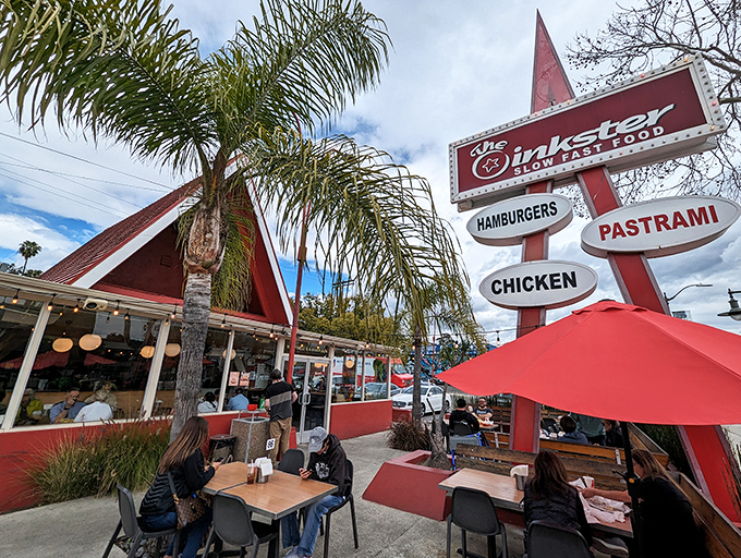 The Oinkster: Where retro charm meets gourmet fast food. This A-frame wonder is like a '50s diner that went to culinary school.