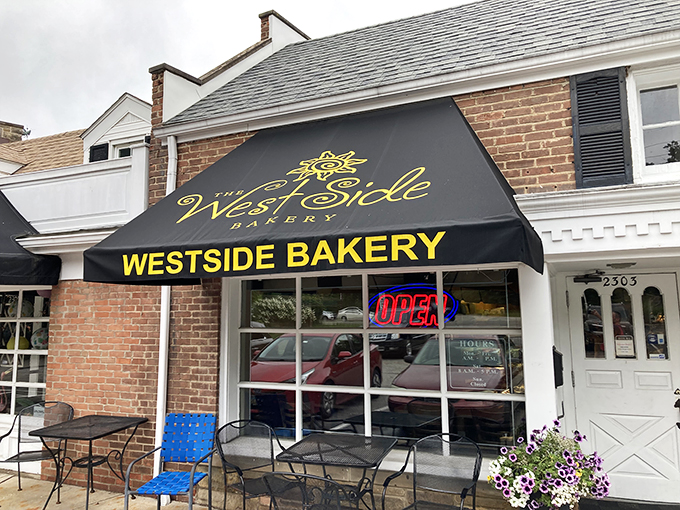 Welcome to carb heaven! The West Side Bakery's inviting storefront promises a sugar rush that'll make you forget about your diet faster than you can say "cream puff."