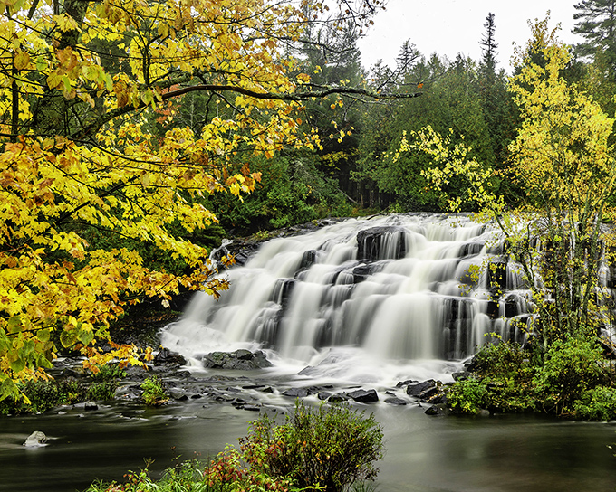 Autumn at Bond Falls: Where Mother Nature throws a color party and everyone's invited. It's like a forest rave, but classier.