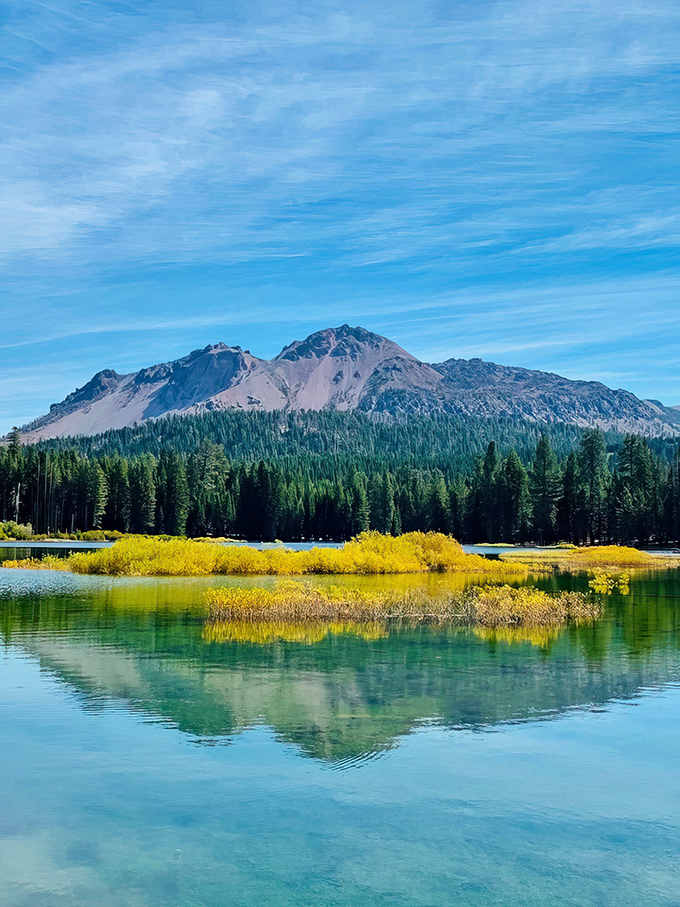 Lassen's peaks play hide-and-seek with the clouds, while golden meadows invite you to twirl like Julie Andrews.