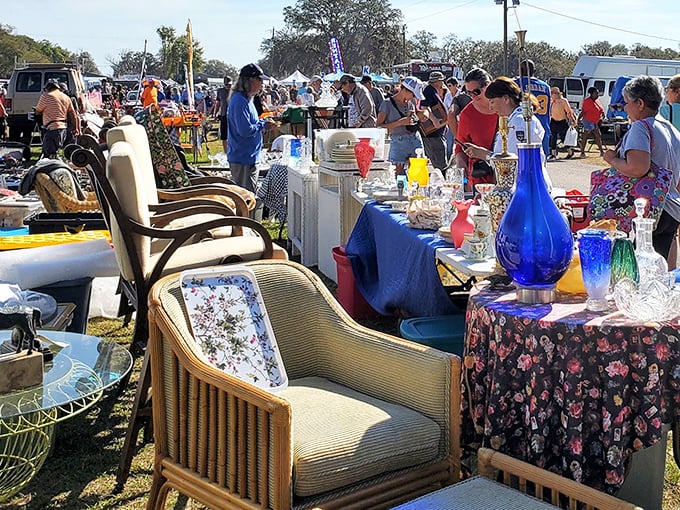 Vintage chairs and colorful glassware galore! This booth at Swap-O-Rama's is a time machine to grandma's living room – with better prices.