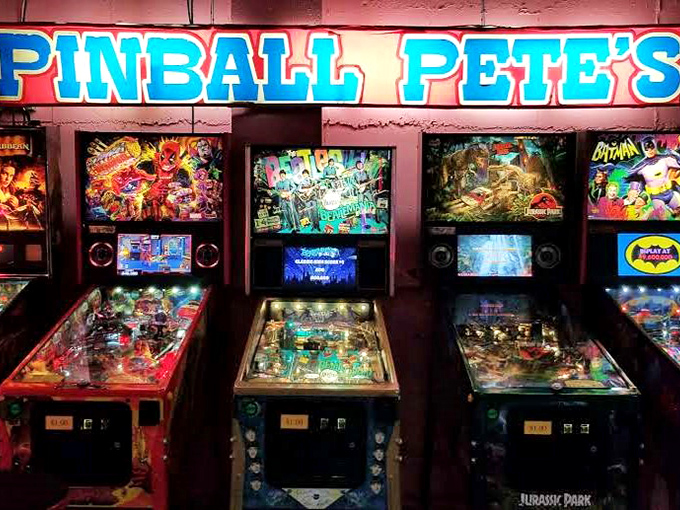 Pinball wizards, unite! The Arcade's sign promises classic thrills, and inside, a symphony of flippers and bumpers awaits your quarters.