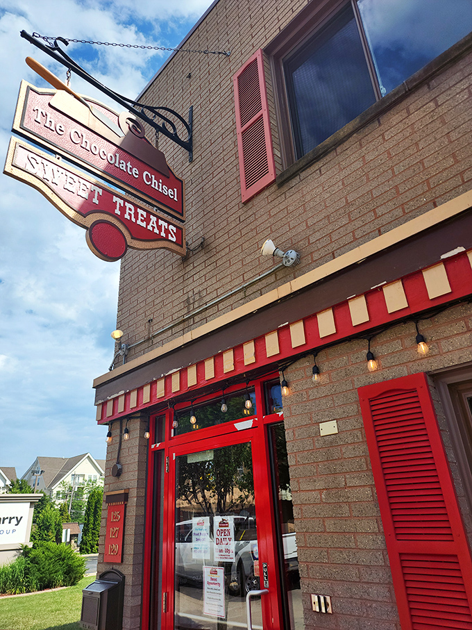 Sweet dreams are made of this! The Chocolate Chisel's cherry-red facade is like a beacon of sugary salvation on a cloudy day.