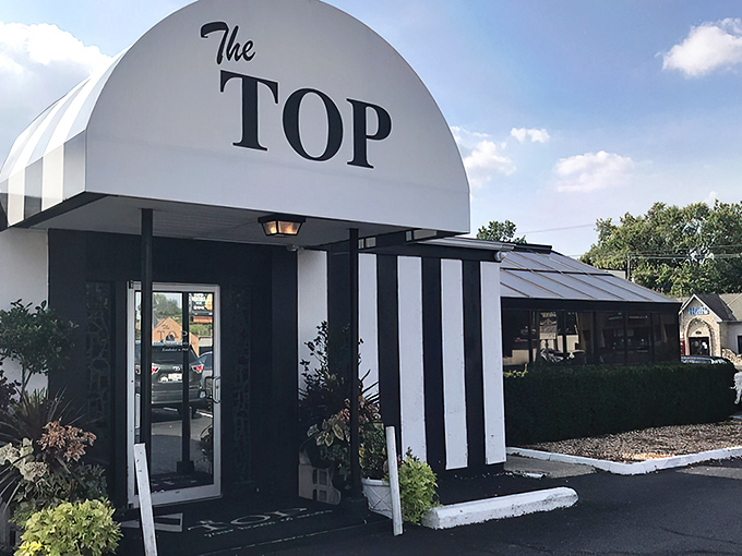 "The Top's retro sign promises a blast from the past. Get ready for a steak that'll make you forget what decade you're in!"