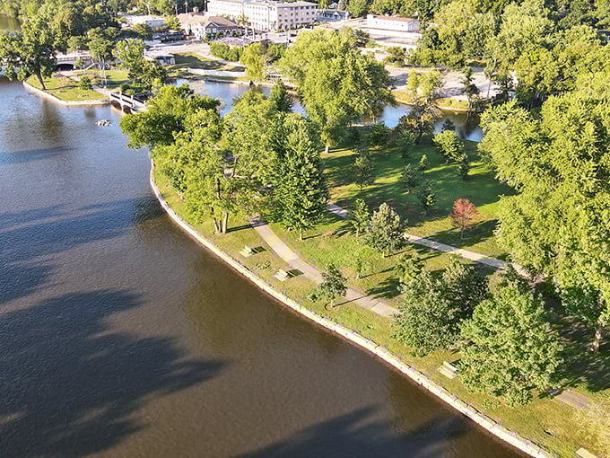 Nature's jigsaw puzzle: Island Park's aerial view reveals a tapestry of green spaces and winding waterways. It's like Mother Nature's own Tetris game!