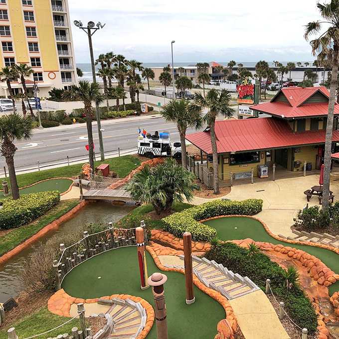 Who needs a bird's eye view when you can have a golfer's paradise? This aerial shot showcases the course's intricate design, nestled between beach views and city skyline.