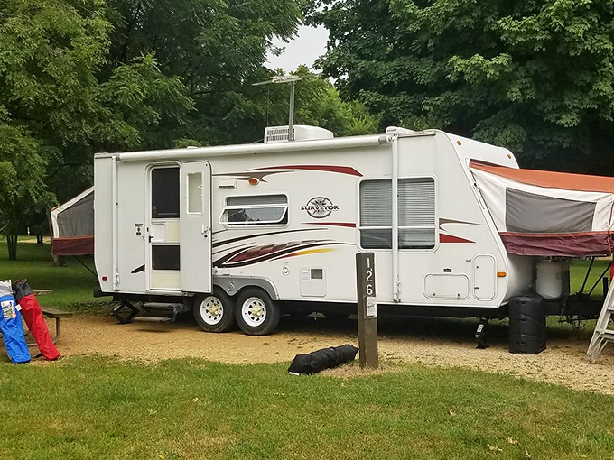 Home sweet home on wheels! This campsite's got more amenities than my first apartment. Talk about glamping in style.