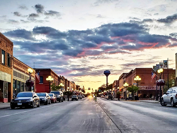 Sunset on Lake Street: Where small-town America shines. The golden hour bathes Chisholm's downtown in a warm glow, turning an ordinary evening into a magical moment.