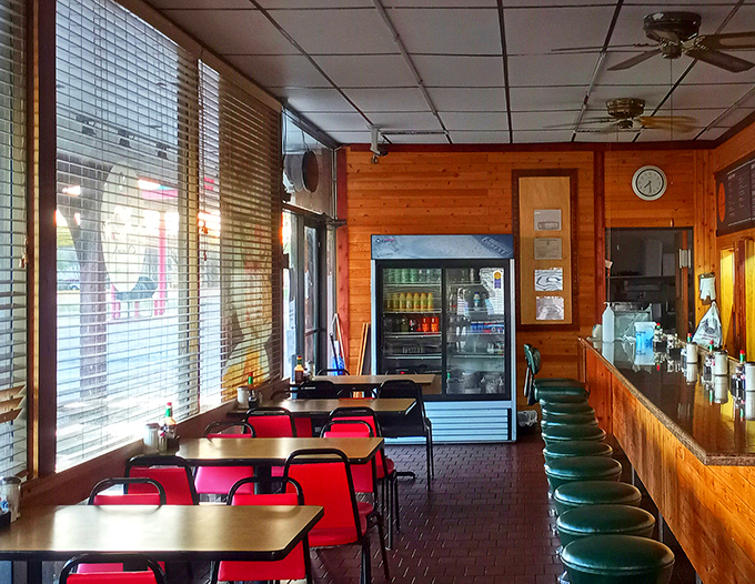 Retro meets rustic in this cozy time capsule. Red booths beckon like old friends, while green stools stand ready for your breakfast adventures.