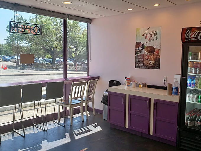 Step into donut paradise! This cozy interior, with its purple accents, feels like the inside of Willy Wonka's more practical cousin's workshop.