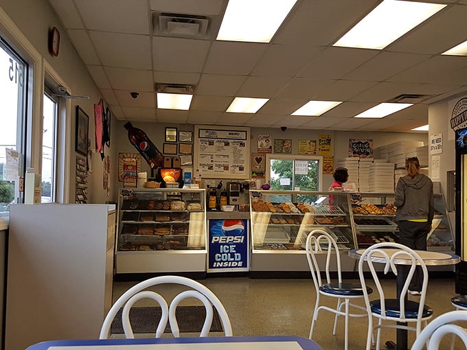 Step into a time machine disguised as a donut shop. This retro interior whispers tales of countless coffee klatches and sugar-fueled conspiracies.