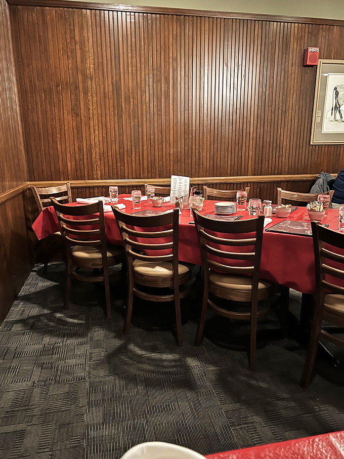 Step into a time capsule of comfort. Red tablecloths and wood paneling set the stage for a steak-fueled journey back to simpler times.