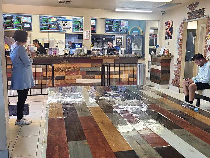 Step into taco paradise! Elmer's colorful interior is a feast for the eyes, with its rustic charm and mouthwatering menu boards.