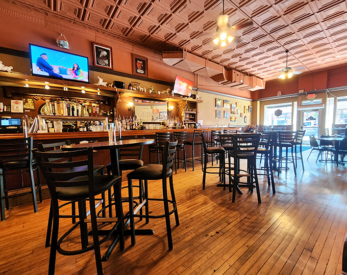 Saddle up to this inviting bar, where the only thing warmer than the wood-paneled walls is the friendly atmosphere.