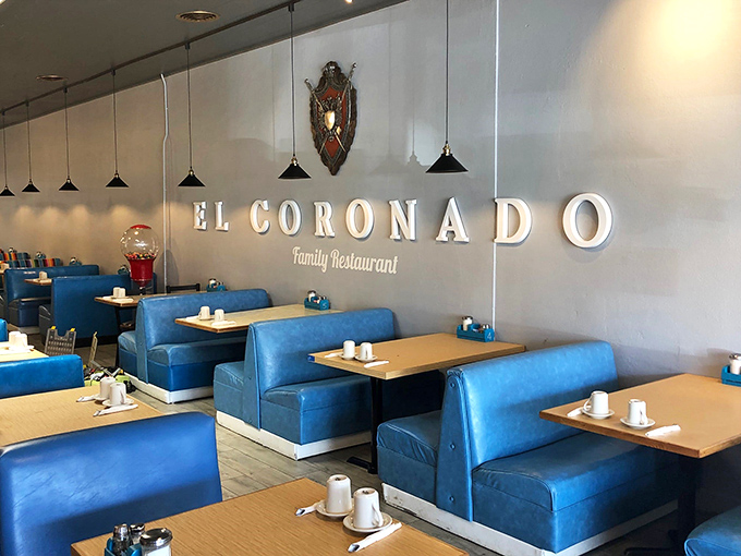 Blue booths and warm lighting create an atmosphere cozier than your abuela's living room. It's like a hug for your soul!