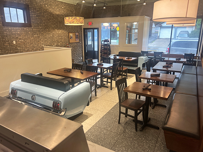 Step into a time machine disguised as a diner. That vintage car seat isn't for show—it's your ticket to a delicious blast from the past.