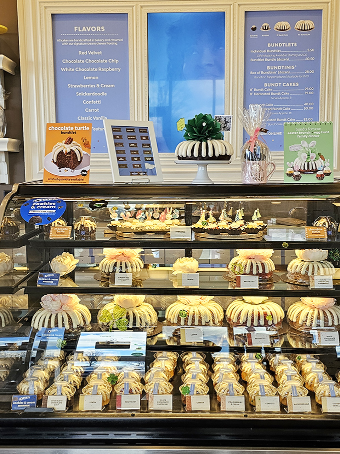 Cake nirvana awaits! This display case is a treasure trove of frosted delights, each bundt a work of edible art.