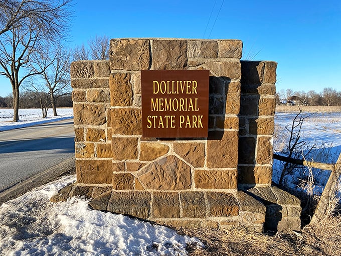 "Winter's calling card: a frosty welcome to adventure!" The park's entrance sign stands proud against a snowy backdrop, promising year-round thrills.