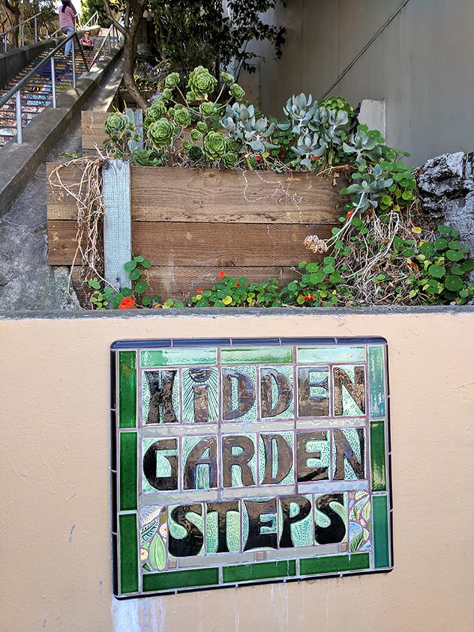 "Hidden Garden Steps" indeed! This sign is like a treasure map, pointing the way to a secret oasis in the concrete jungle.
