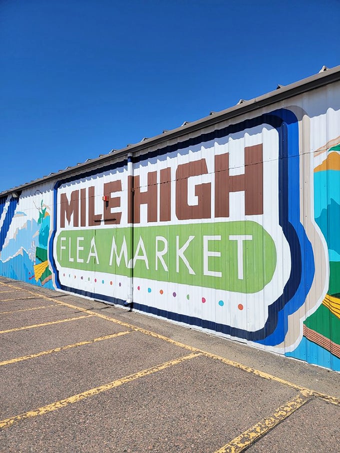 A mural that speaks volumes! This vibrant wall art screams 'Mile High Flea Market' louder than a New Yorker hailing a taxi. It's Instagram-worthy, folks!