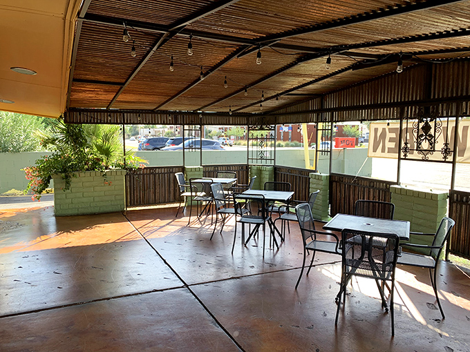 Who needs a fancy patio when you've got this charming al fresco setup? It's like dining in your cool neighbor's backyard, but with better chicken.