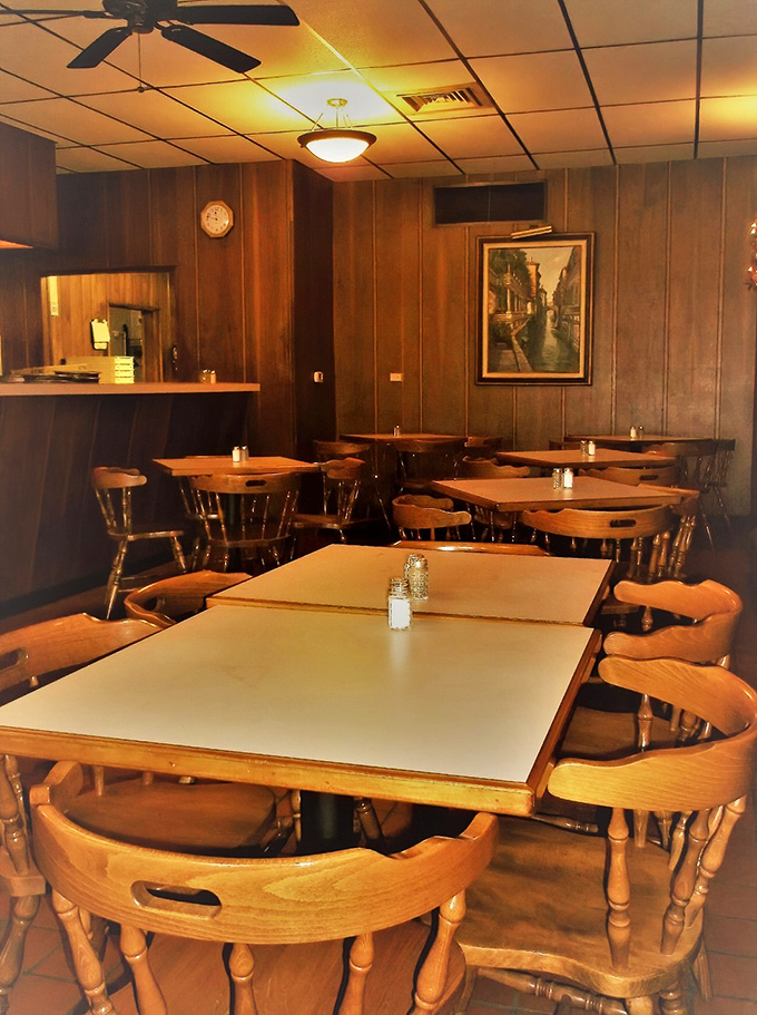 Cozy vibes and wood paneling galore! This dining area feels like your favorite aunt's living room, if she happened to serve killer pizza.