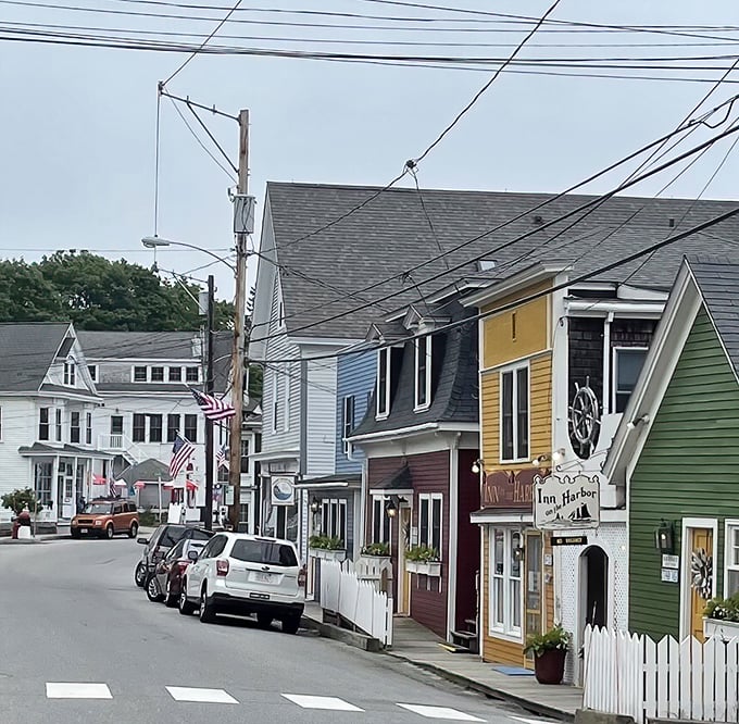Main Street magic: Colorful clapboard buildings line up like a box of crayons, each one telling a story of small-town charm and coastal living.