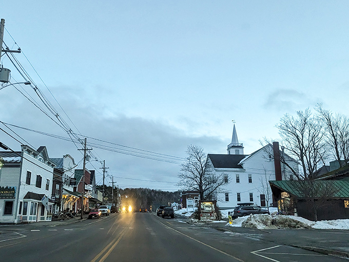 Main Street after dark: Norman Rockwell meets Stephen King in this charming, slightly eerie small-town scene.