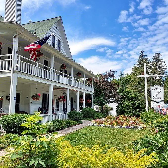 Stars, stripes, and serenity: This classic American inn stands proud, its wraparound porch promising lazy afternoons and endless stories.