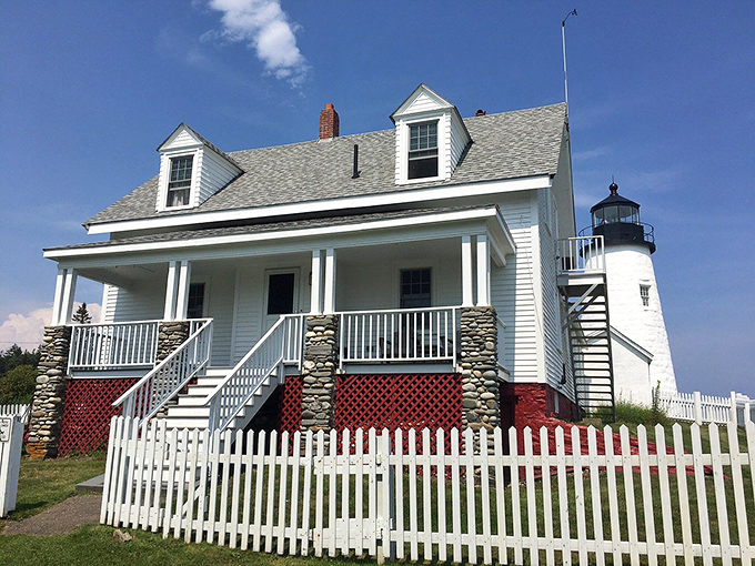 Home sweet lighthouse home! This charming keeper's house looks like it's straight out of a Norman Rockwell painting, minus the confused pizza delivery guy.