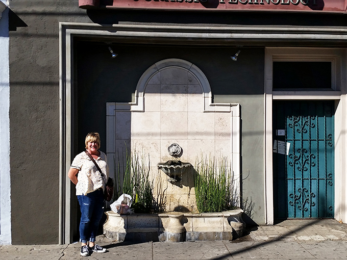 "Knock knock, who's there? Curiosity!" The blue-green door beckons, while the stone cherub seems to whisper, "Prepare for the unexpected."