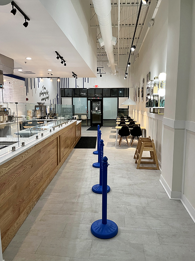 Step into a minimalist's dream: Clean lines, light wood, and white walls create the perfect backdrop for colorful pastry artistry.