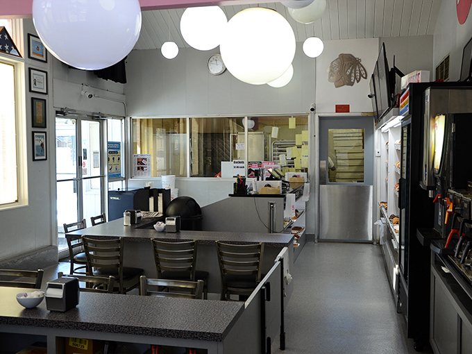 Step into a time capsule of deliciousness! This cozy interior, with its retro charm, feels like a warm hug from your favorite grandma &ndash; if grandma were made of donuts.