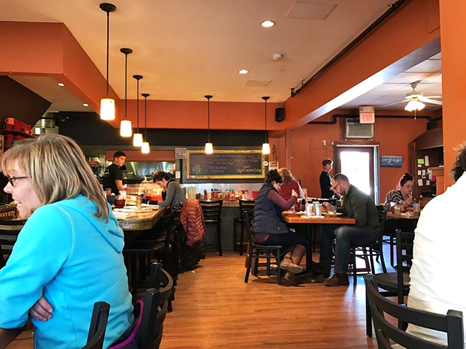 Step into warmth and welcome. This cozy interior feels like a hug from your favorite aunt, if she were also a culinary genius.