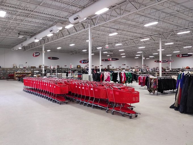 Rows of red carts stand at attention, ready for their marching orders. It's like Santa's workshop, but for thrift store enthusiasts.