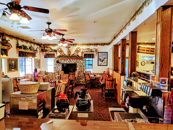 Step inside and feel the warmth embrace you. This cozy interior is like a bear hug for your soul, complete with wooden beams and a fireplace that whispers, "Stay awhile."