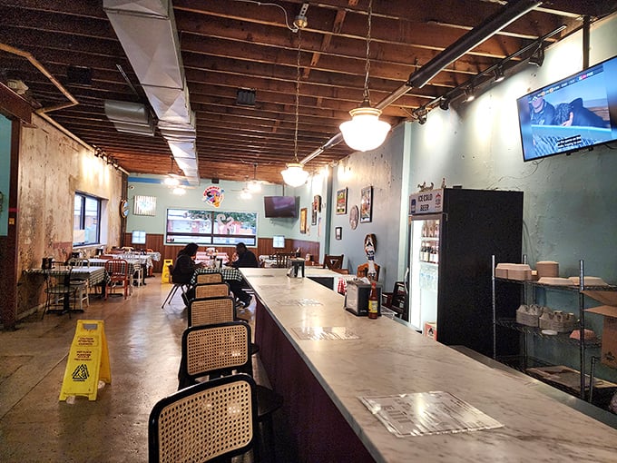 Step into a time capsule of comfort! This dining area is where checkered tablecloths meet chicken-induced euphoria. It's not fancy, but neither was grandma's kitchen, and her food was spectacular.