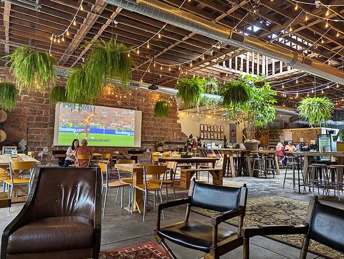 Step into a culinary wonderland! The Brick's interior is a perfect blend of industrial chic and cozy charm, complete with hanging plants and twinkling lights.