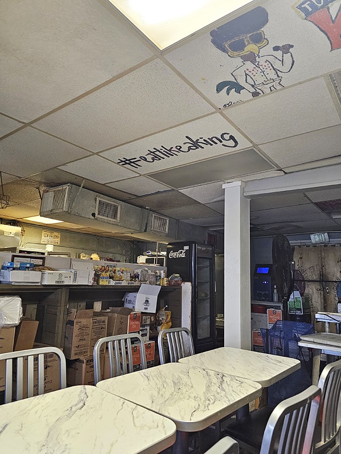 Forget fancy tablecloths - here, "#eatlikeking" is scrawled on the ceiling. It's not just a hashtag, it's a way of life.