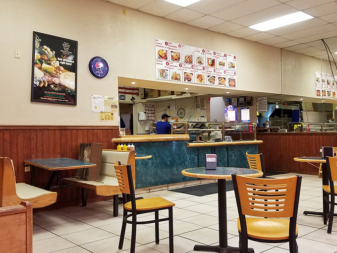 Step into flavor town! This no-frills interior might not win design awards, but the menu board promises a feast fit for poultry royalty.