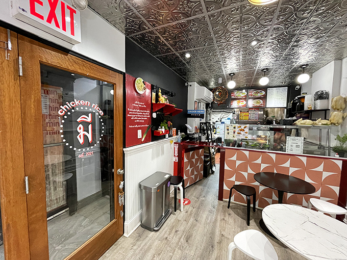 Step into flavor town! This cozy interior, with its tin ceiling and modern touches, sets the stage for a chicken feast fit for royalty.