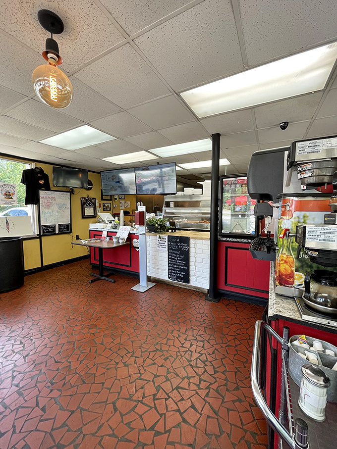 Step into a world where fried chicken reigns supreme. This cozy interior, with its vibrant red and yellow hues, sets the stage for a finger-lickin' good time.