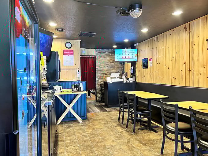 Cozy wood paneling and simple furnishings set the stage for a comfort food adventure. No fancy frills, just fantastic flavors ahead!