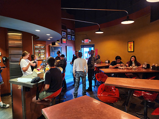 Step into burger nirvana! The cozy interior buzzes with anticipation, as diners eagerly await their English muffin-hugged patties of perfection.