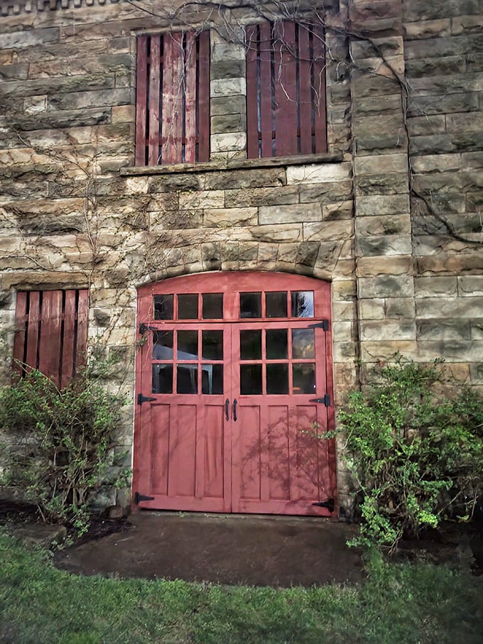 Red doors beckon like portals to another dimension. This stone sentinel stands guard over a century of stories, both spine-tingling and sublime.