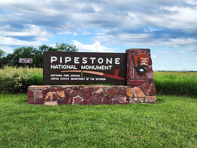 Welcome to Pipestone, where even the sign rocks! This entrance is more inviting than a potluck dinner invitation.