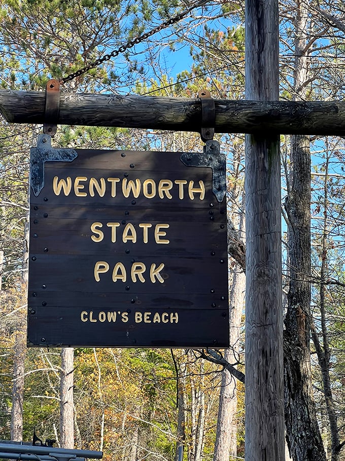"Welcome to Wentworth: Where even the signs have character!" This rustic wooden marker promises adventure at Clow's Beach, beckoning explorers with its old-school charm.