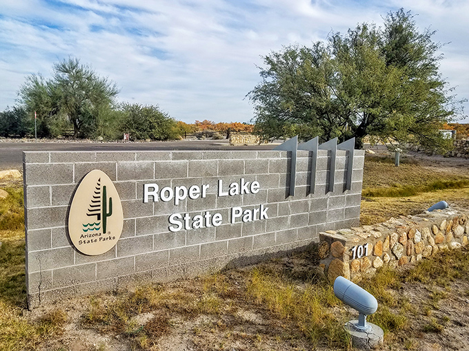Welcome to paradise! This sign marks the entrance to your next adventure. Just follow the cactus - it knows the way.